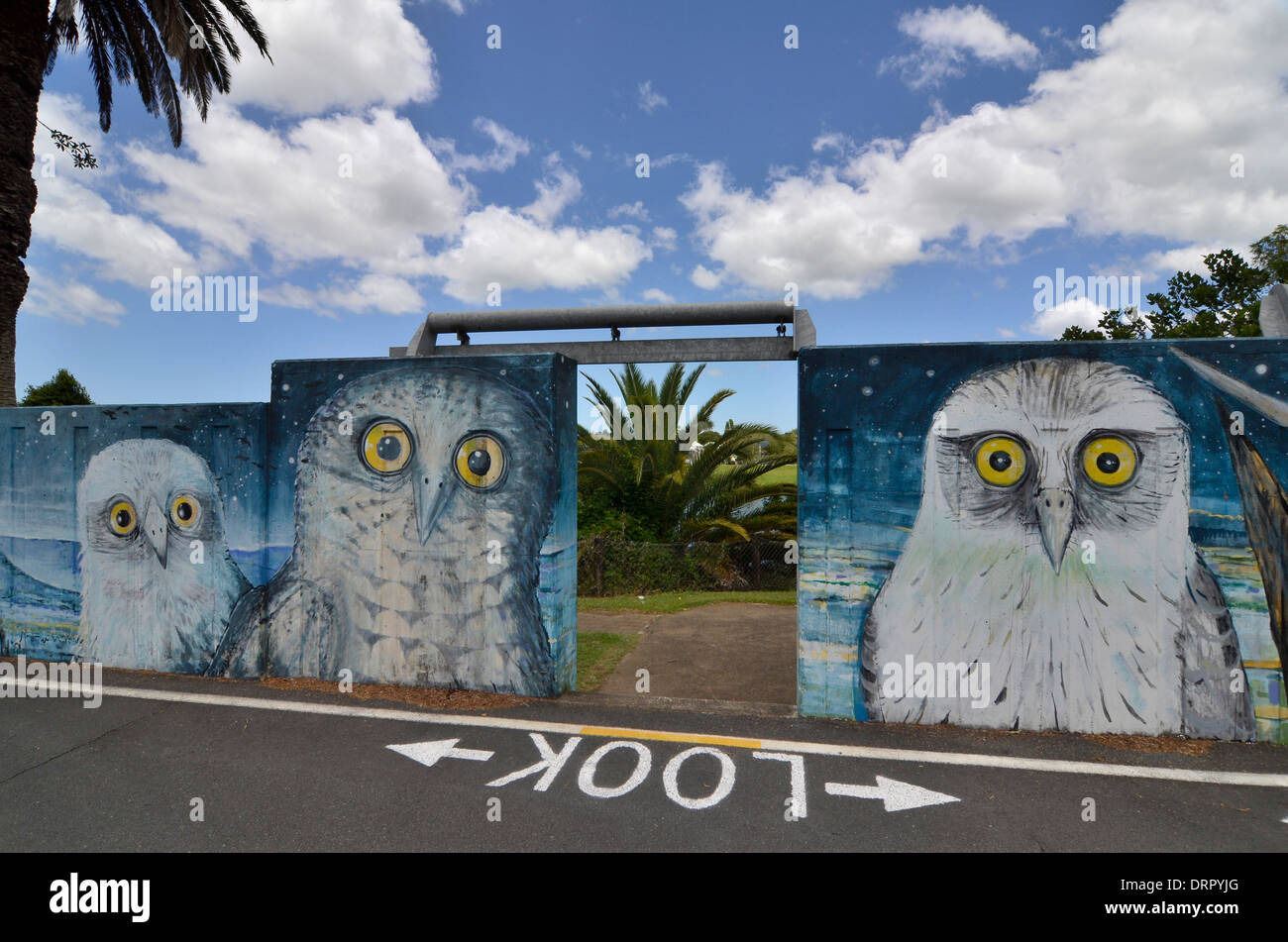 animal and bird and owl mural on concrete flood protection wall in ...