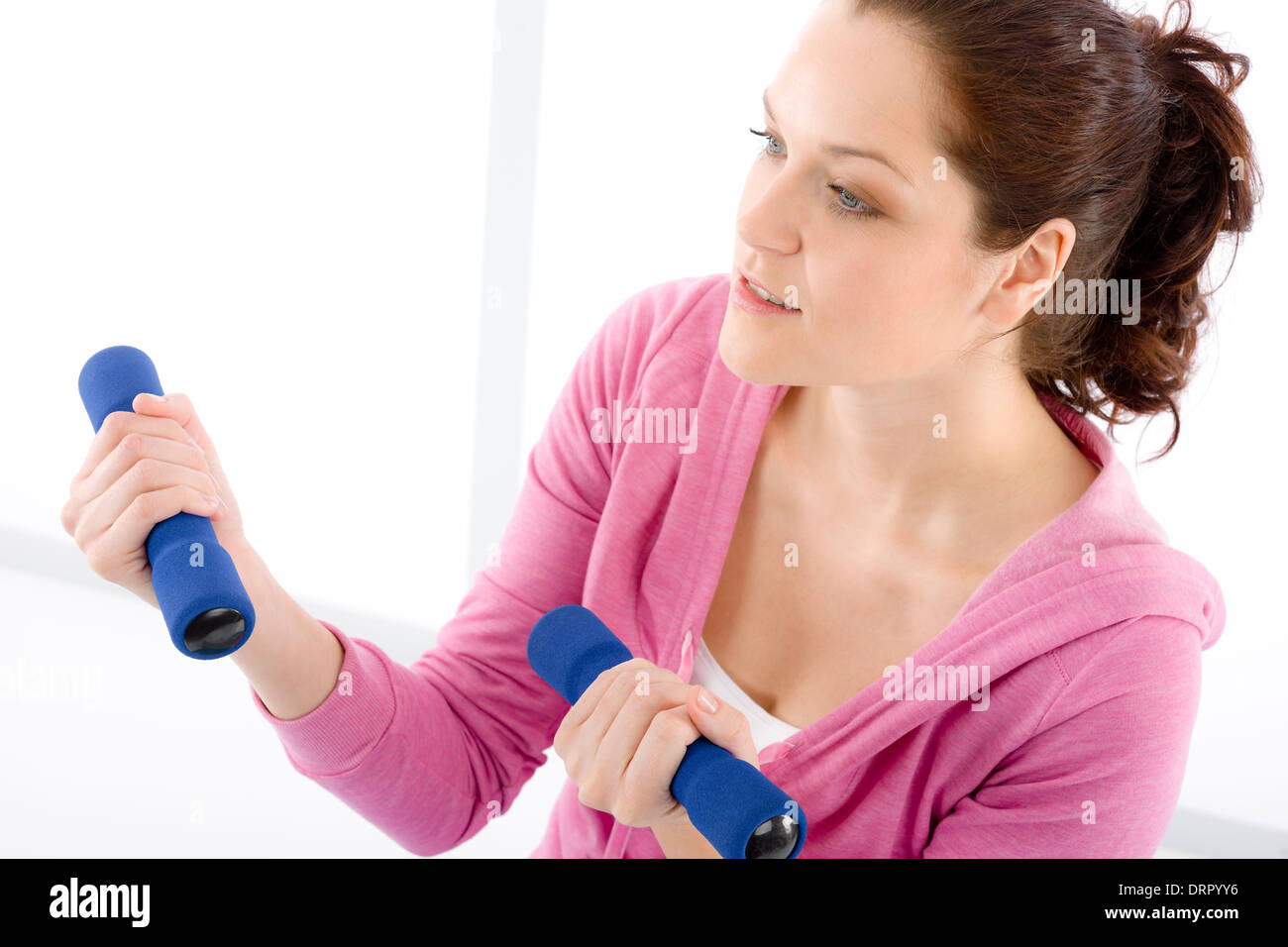 Fitness happy woman exercise dumbbell gym Stock Photo - Alamy