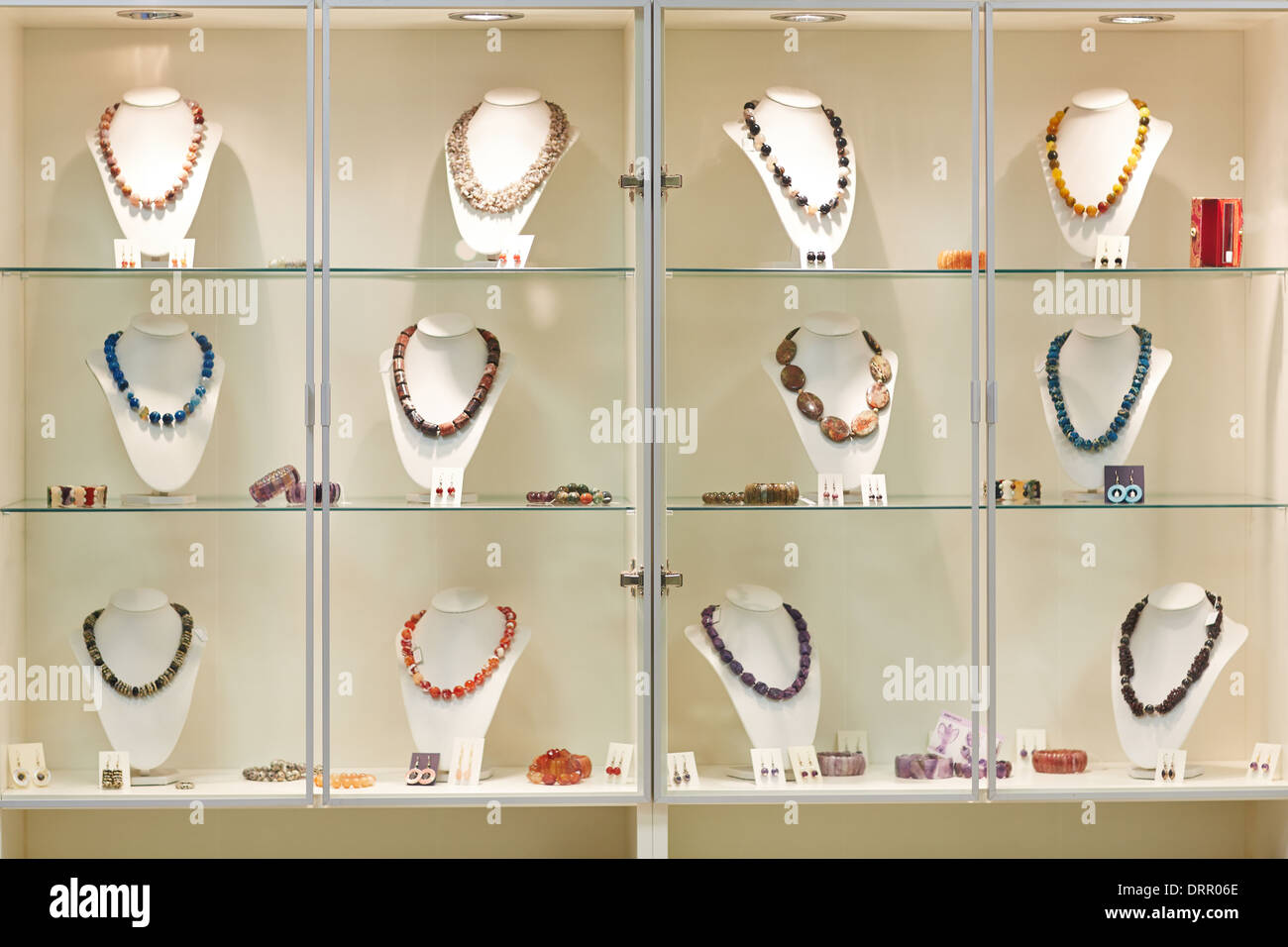 Different necklaces on display in jewelry store window Stock Photo - Alamy