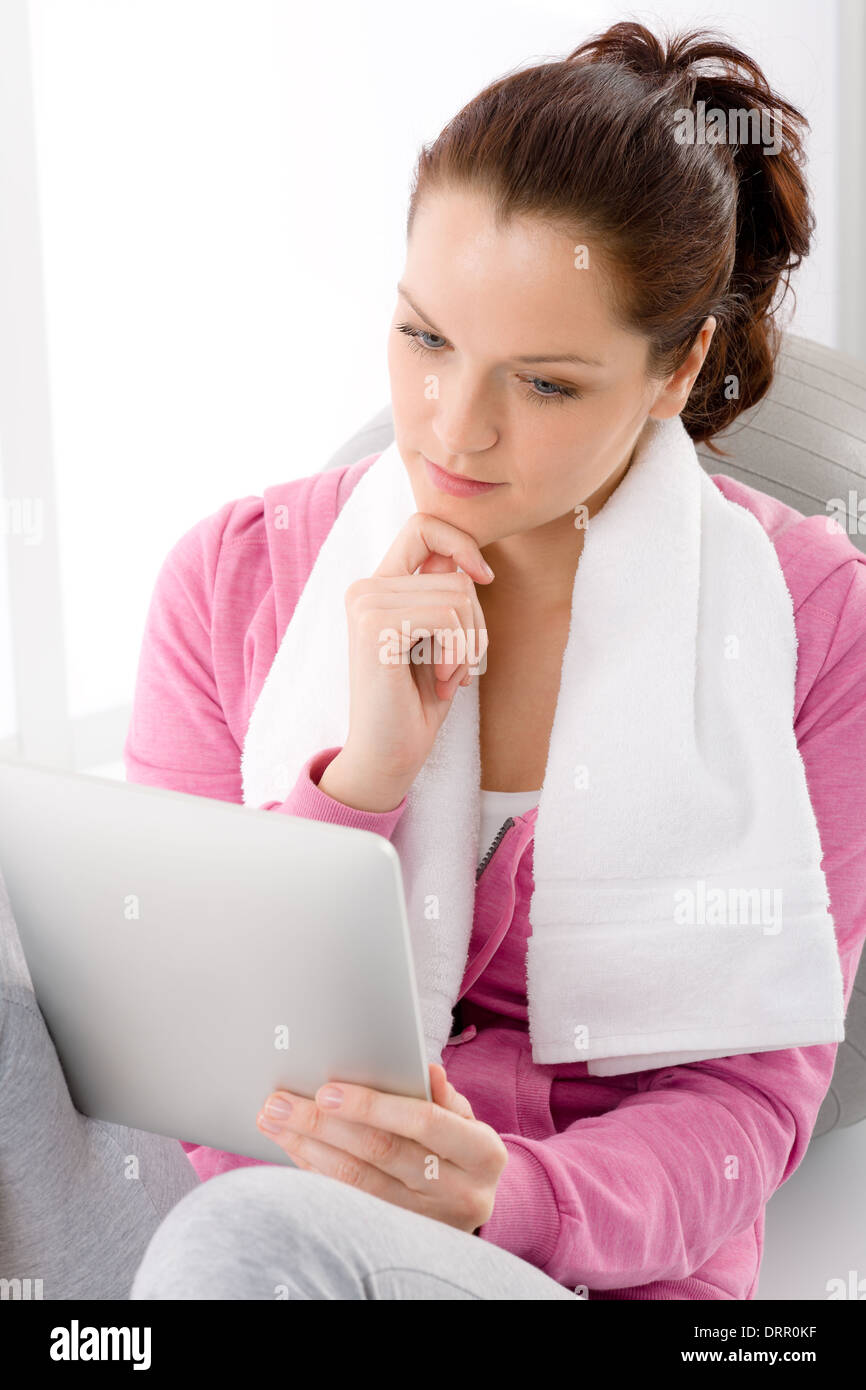 Woman touch screen computer fitness outfit Stock Photo - Alamy