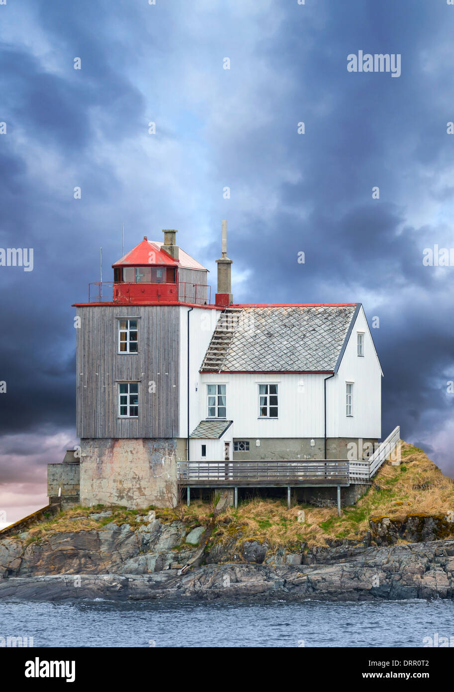 Old Norwegian lighthouse on rocky island with dramatic sky Stock Photo ...