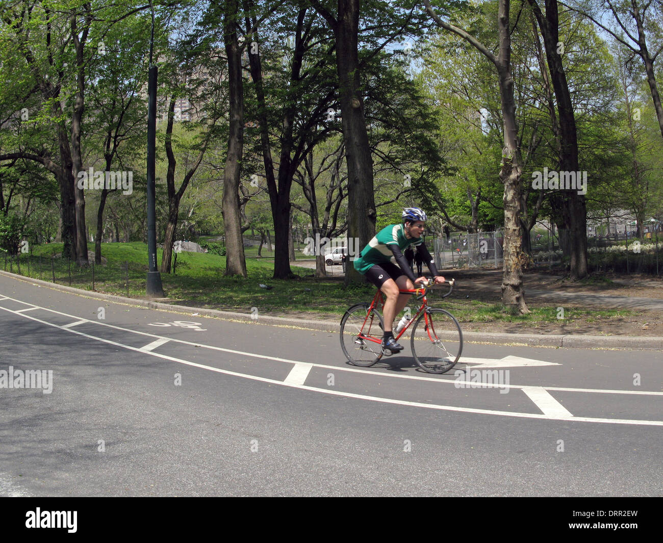 A cyclist taking a curve on the bike path in an apparently empty ...