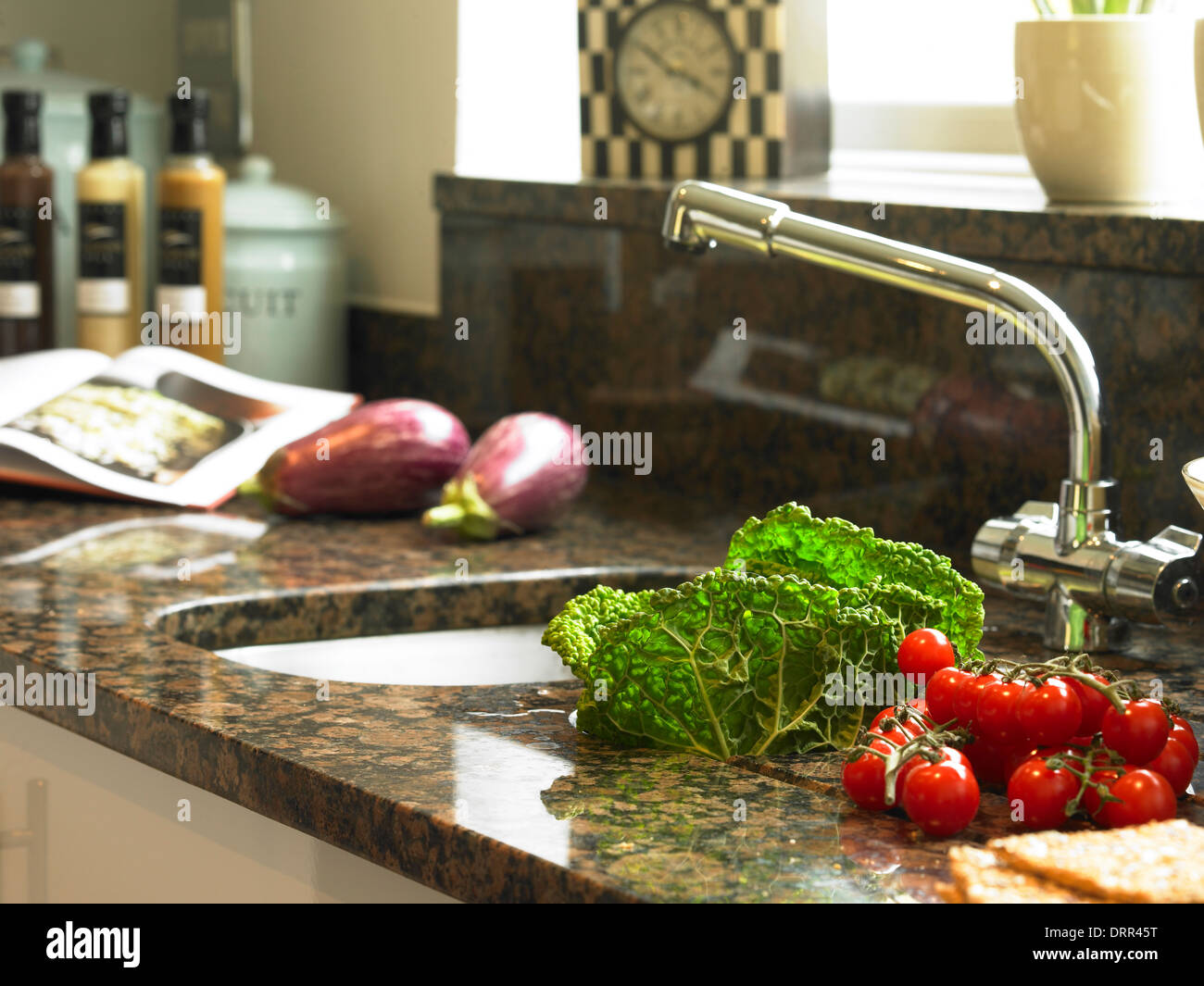Food preparation at the kitchen sink Stock Photo - Alamy