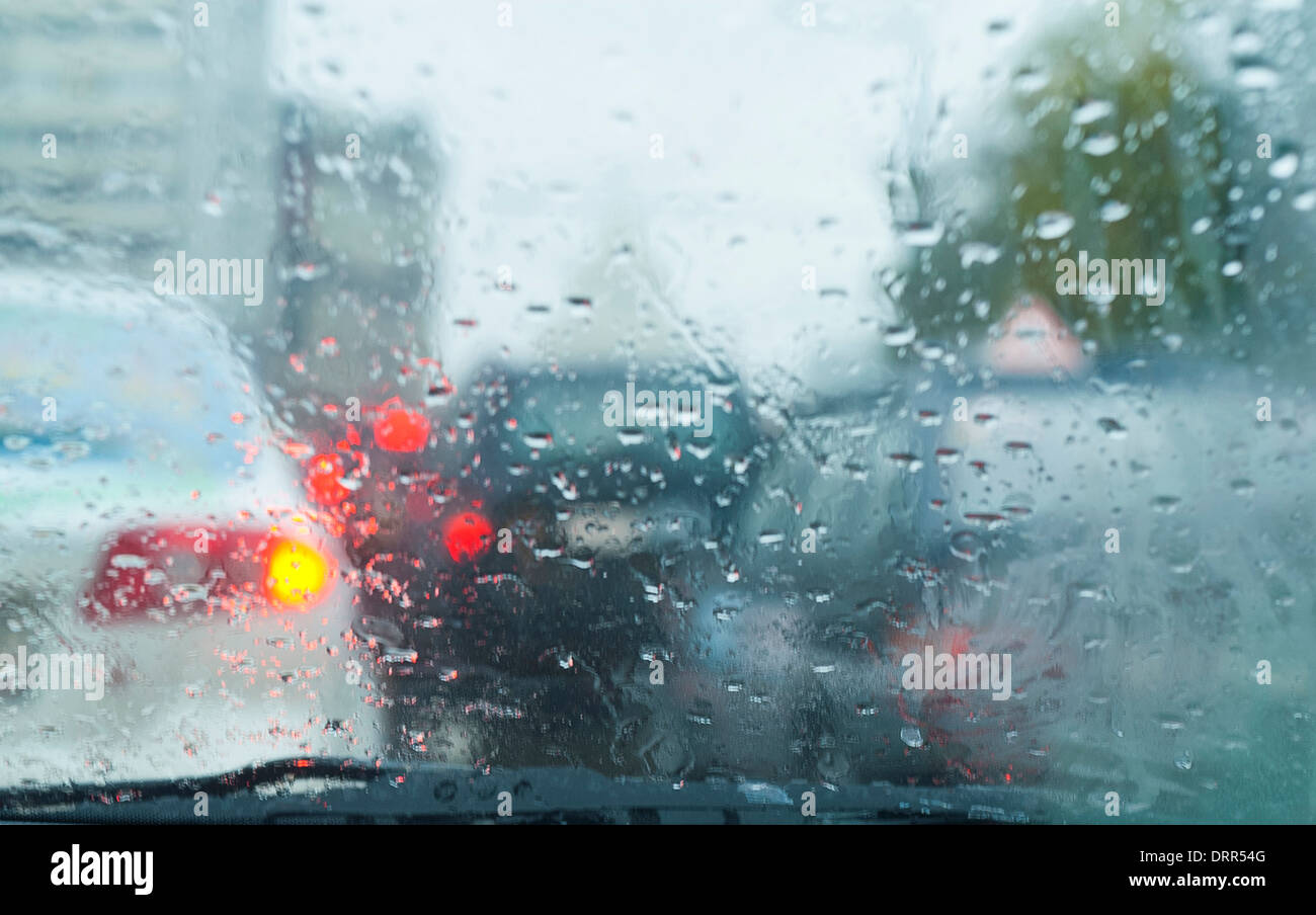 Rainy day in traffic jam, urban scene Stock Photo - Alamy