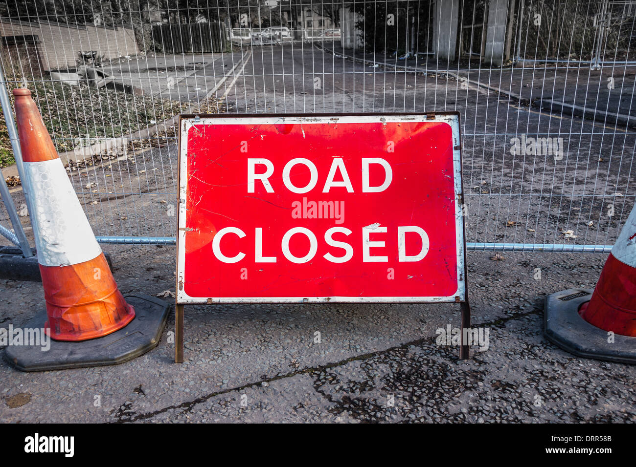 Sign and barrier at both ends of a road making it obvious that the road ...