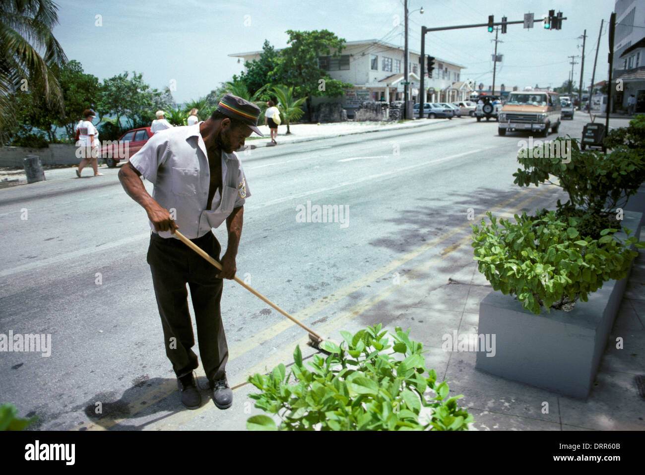 Man sweeping street in Cozumel, Mexico Stock Photo - Alamy