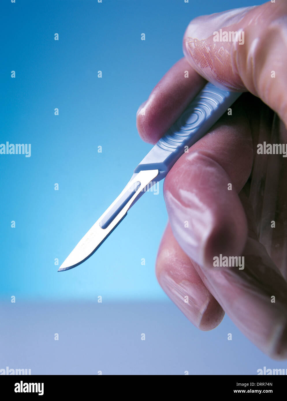 Gloved Hand With Scalpel High Resolution Stock Photography and Images ...