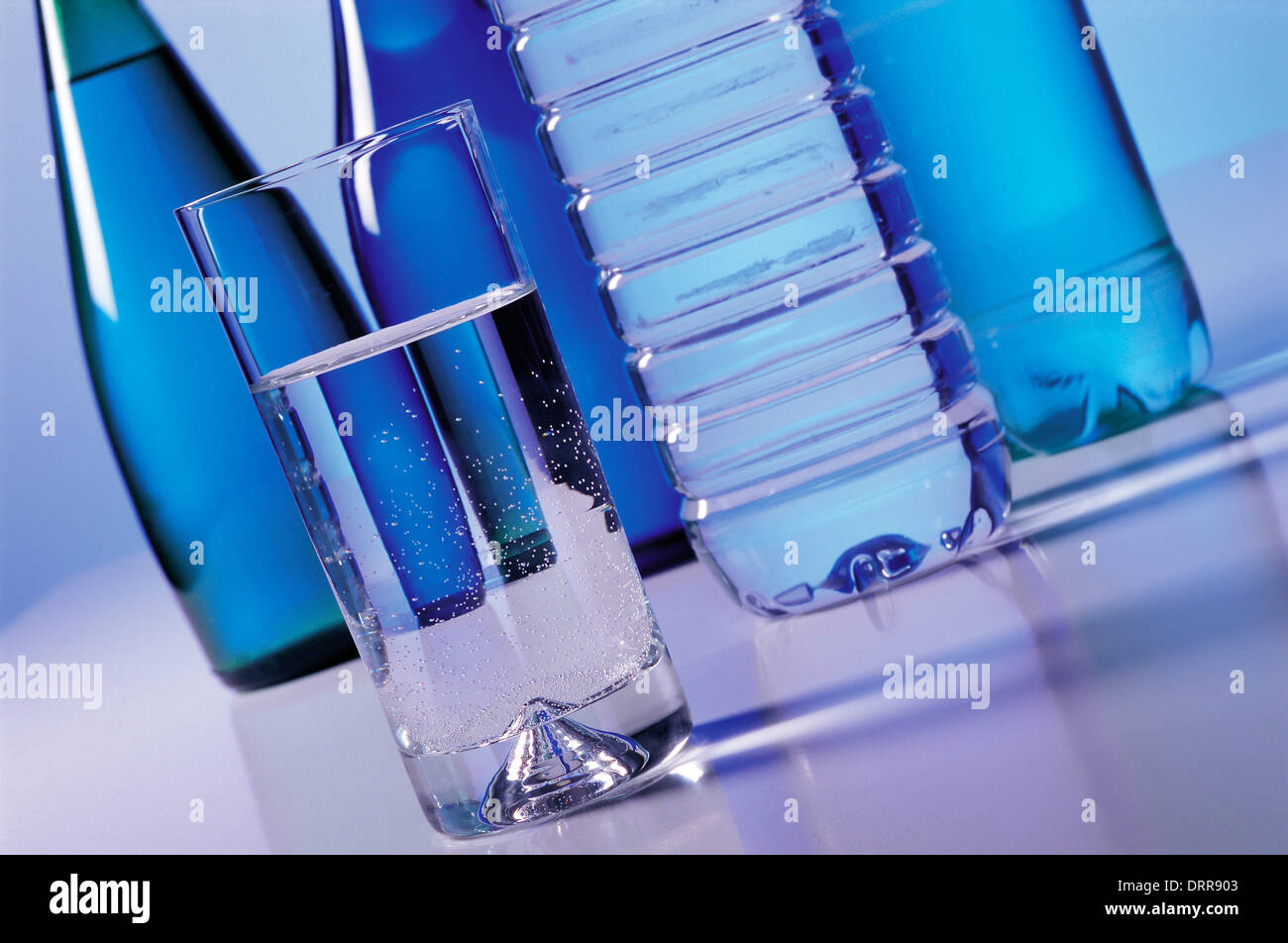 Bottled Mineral Water and Glass Stock Photo - Alamy