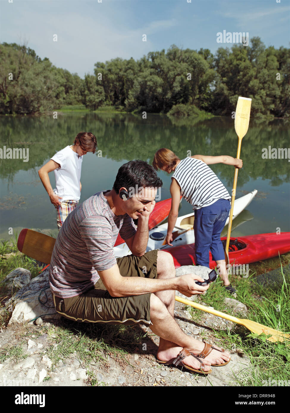 men with canoe in nature Stock Photo - Alamy