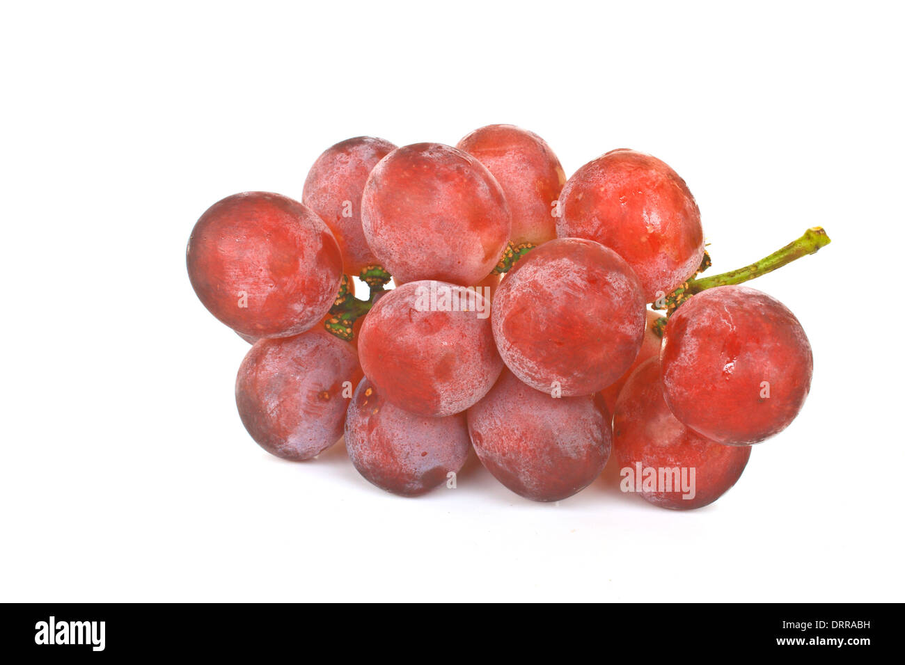 Cluster of ripe juicy red grapes on a white background Stock Photo - Alamy
