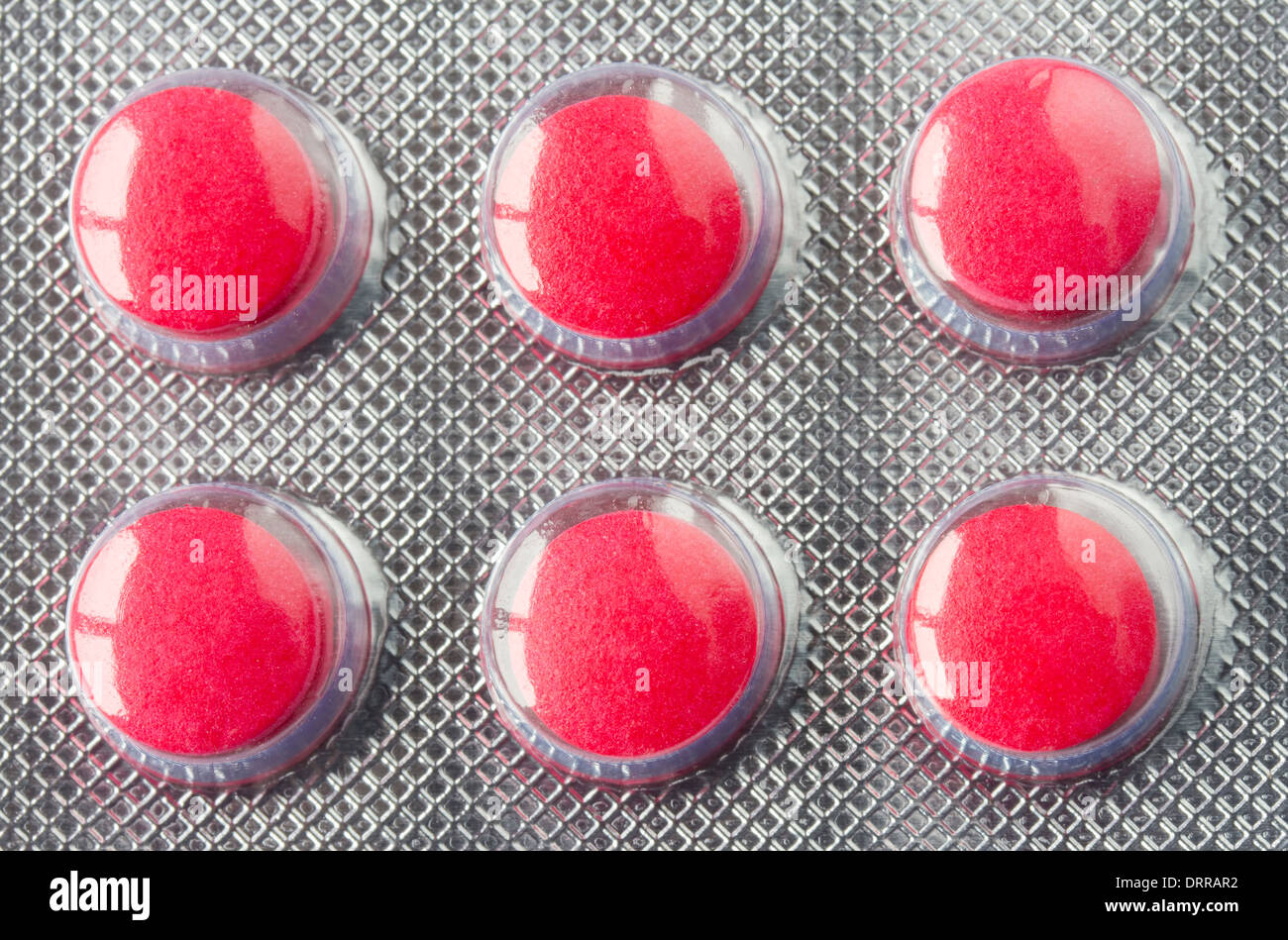 Red pills in a blister pack Stock Photo - Alamy