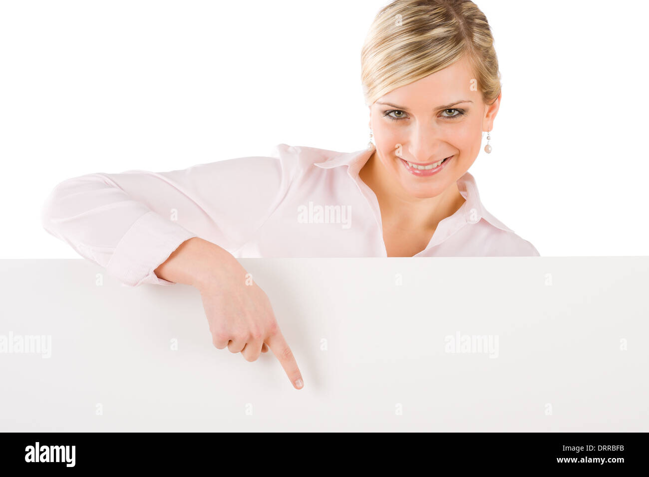 Businesswoman behind empty banner point down Stock Photo - Alamy