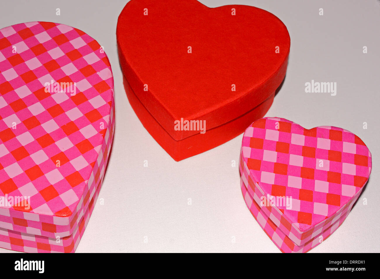 pink and red heart shaped gift boxes to show the concept of love on ...