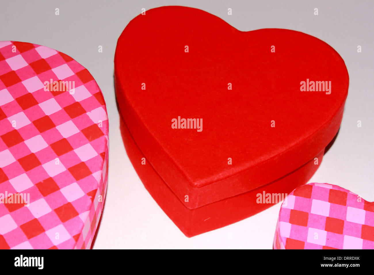 pink and red heart shaped boxes showing the concept of love on ...