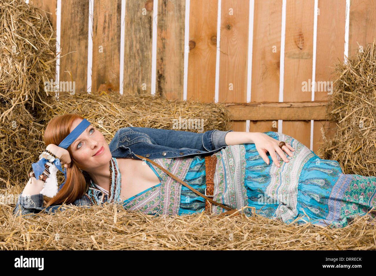 Beautiful woman lying on hay hi-res stock photography and images - Alamy