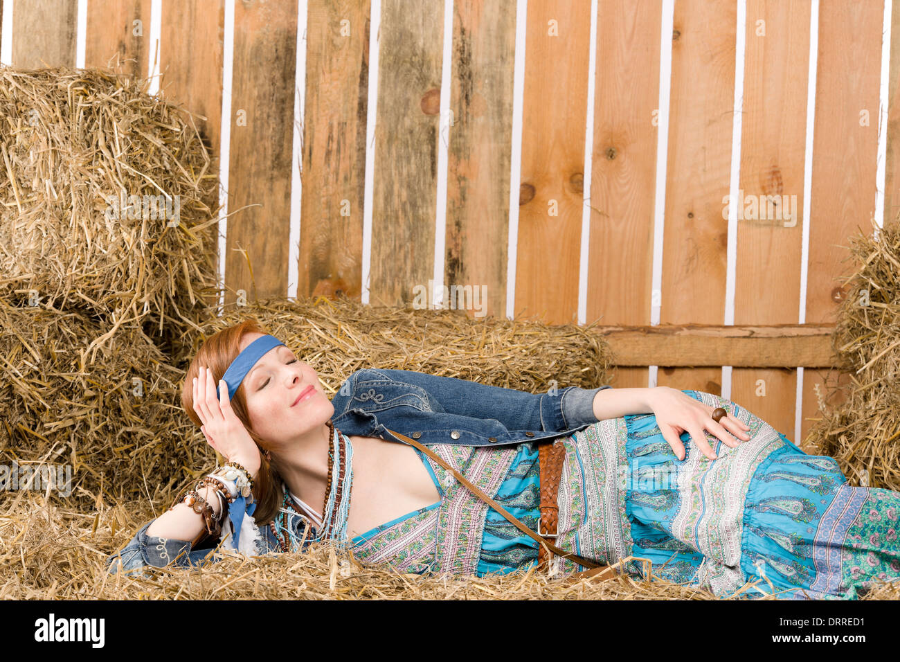 Young hippie woman lying on hay relax Stock Photo - Alamy