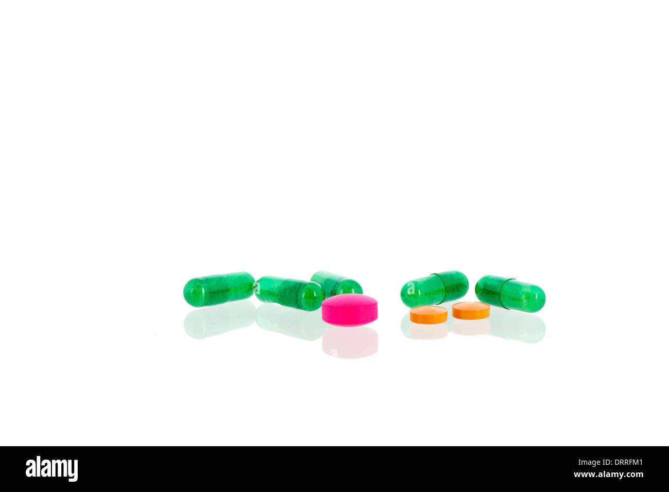 Many different medicines in capsules and pills isolated over white ...