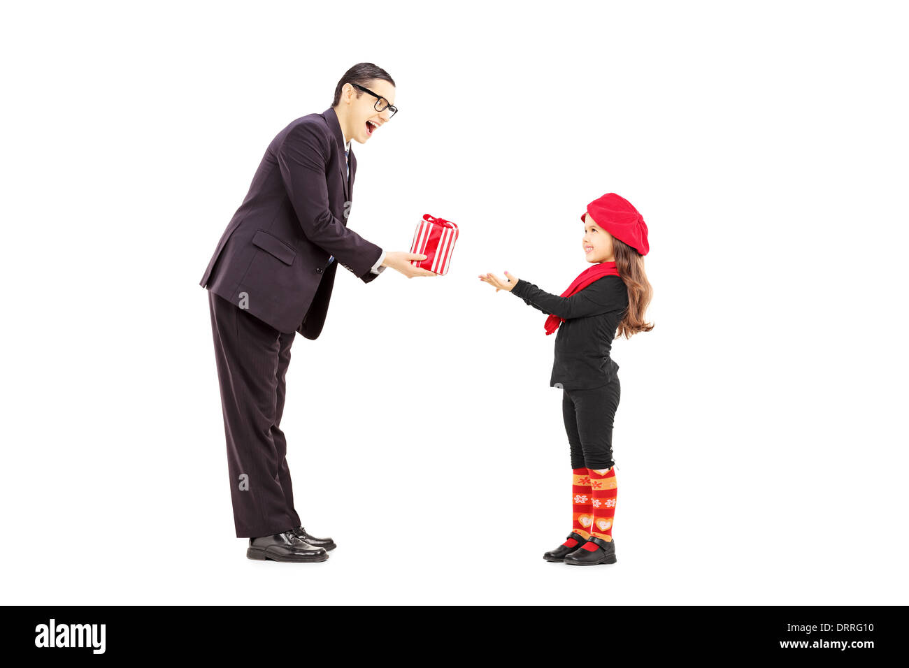 Full length portrait of a man giving present to an overjoyed little ...