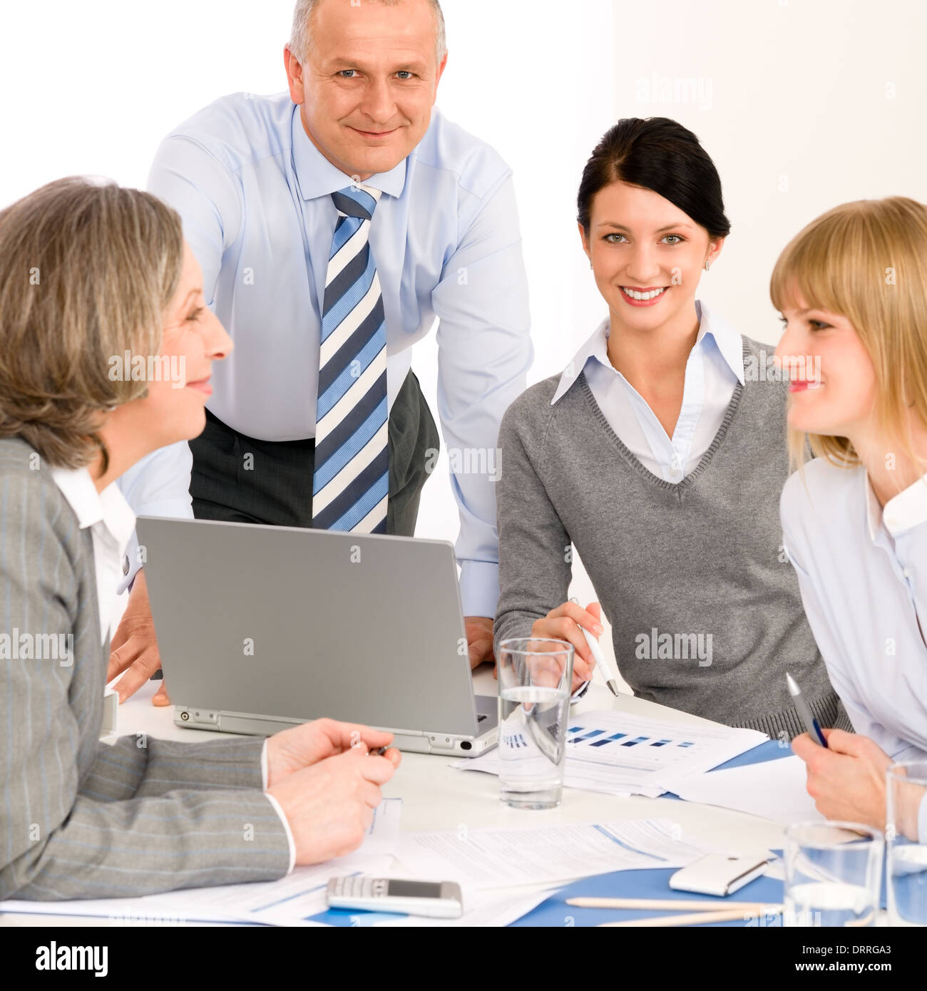 Business team meeting people around table Stock Photo - Alamy