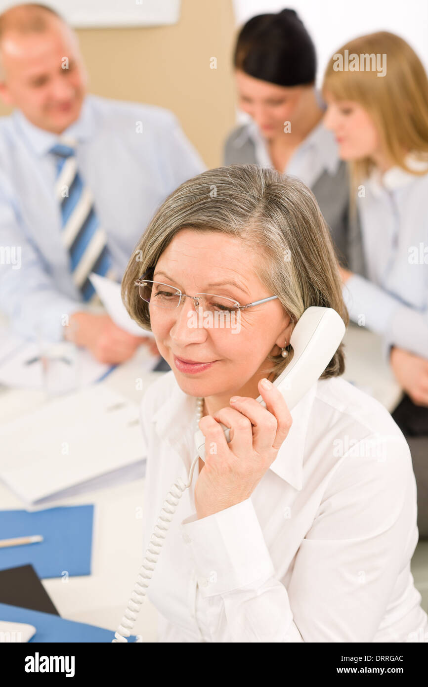 Business team meeting executive senior woman Stock Photo - Alamy