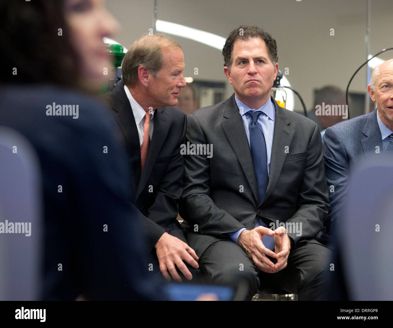 Dell CEO Michael Dell (r) listens during the grand opening ceremony of ...