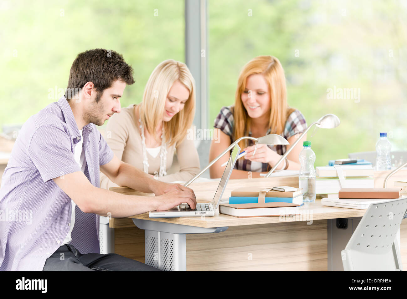 Group of young high school students learning Stock Photo - Alamy