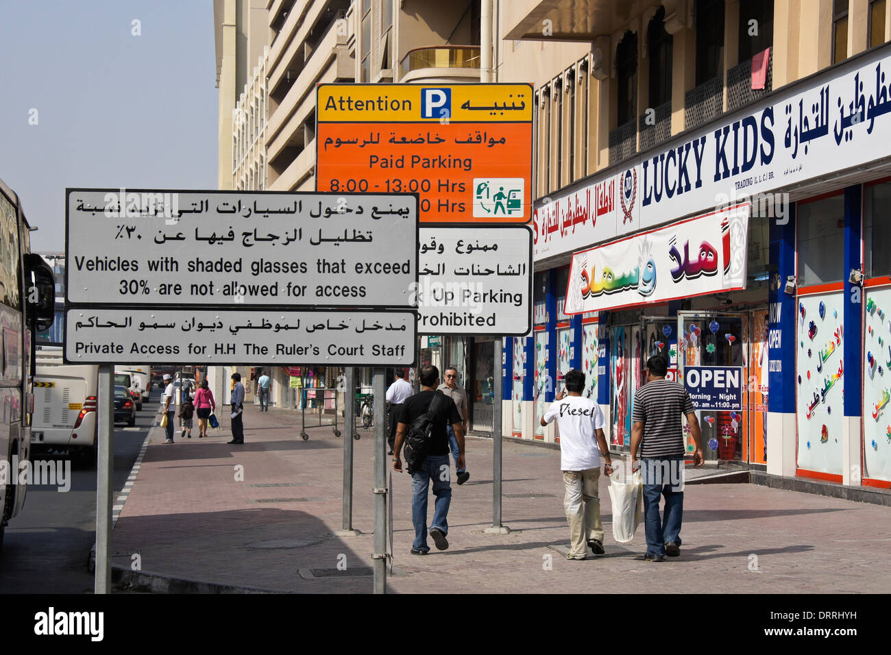 Street scene with signs in Arabic and English, Dubai, United Arab ...