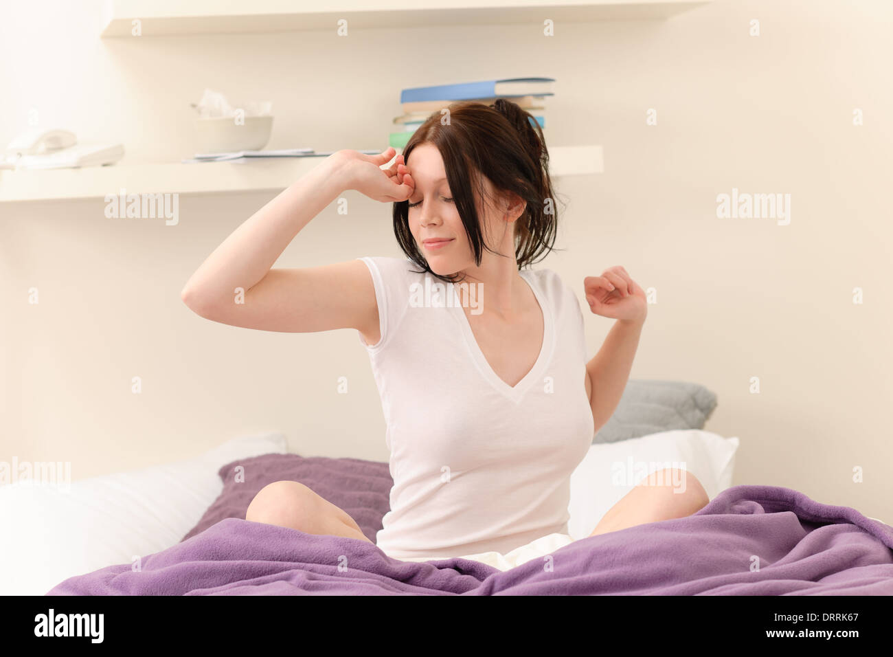 Attractive student girl wake up at home Stock Photo - Alamy