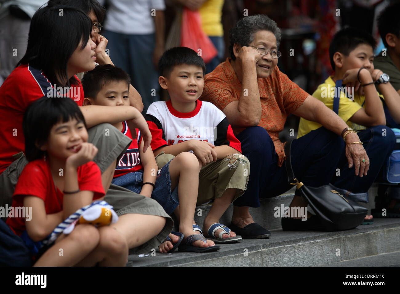 People sitting around a plaza in Chinatown, Singapore, Asia Stock Photo ...
