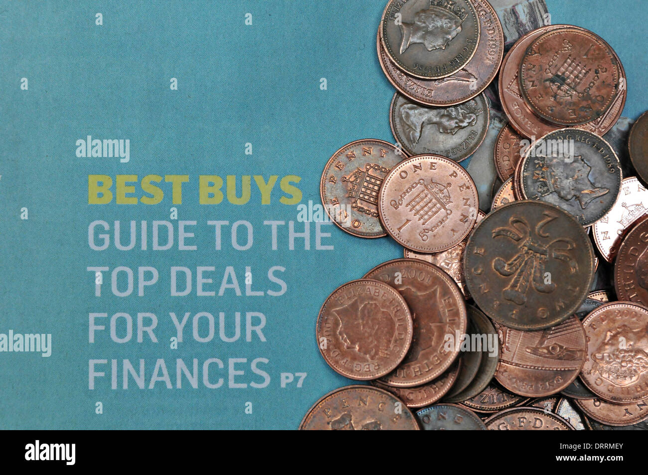 small copper change on a newspaper finance article Stock Photo - Alamy