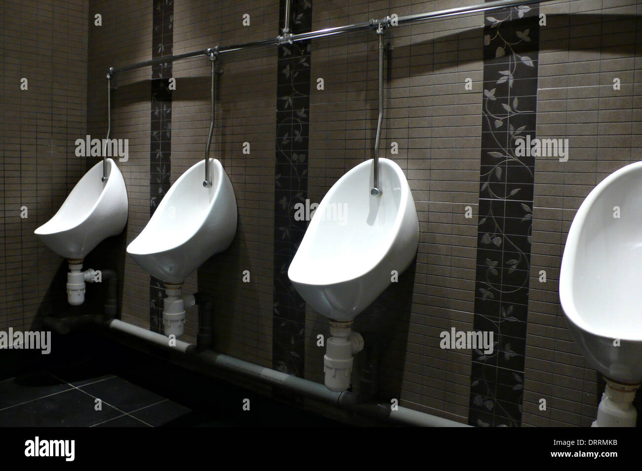 a row of urinals in a men's loo Stock Photo - Alamy