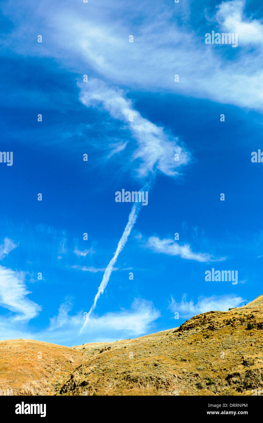 Unusual white clouds against a clear blue Colorado sky Stock Photo - Alamy