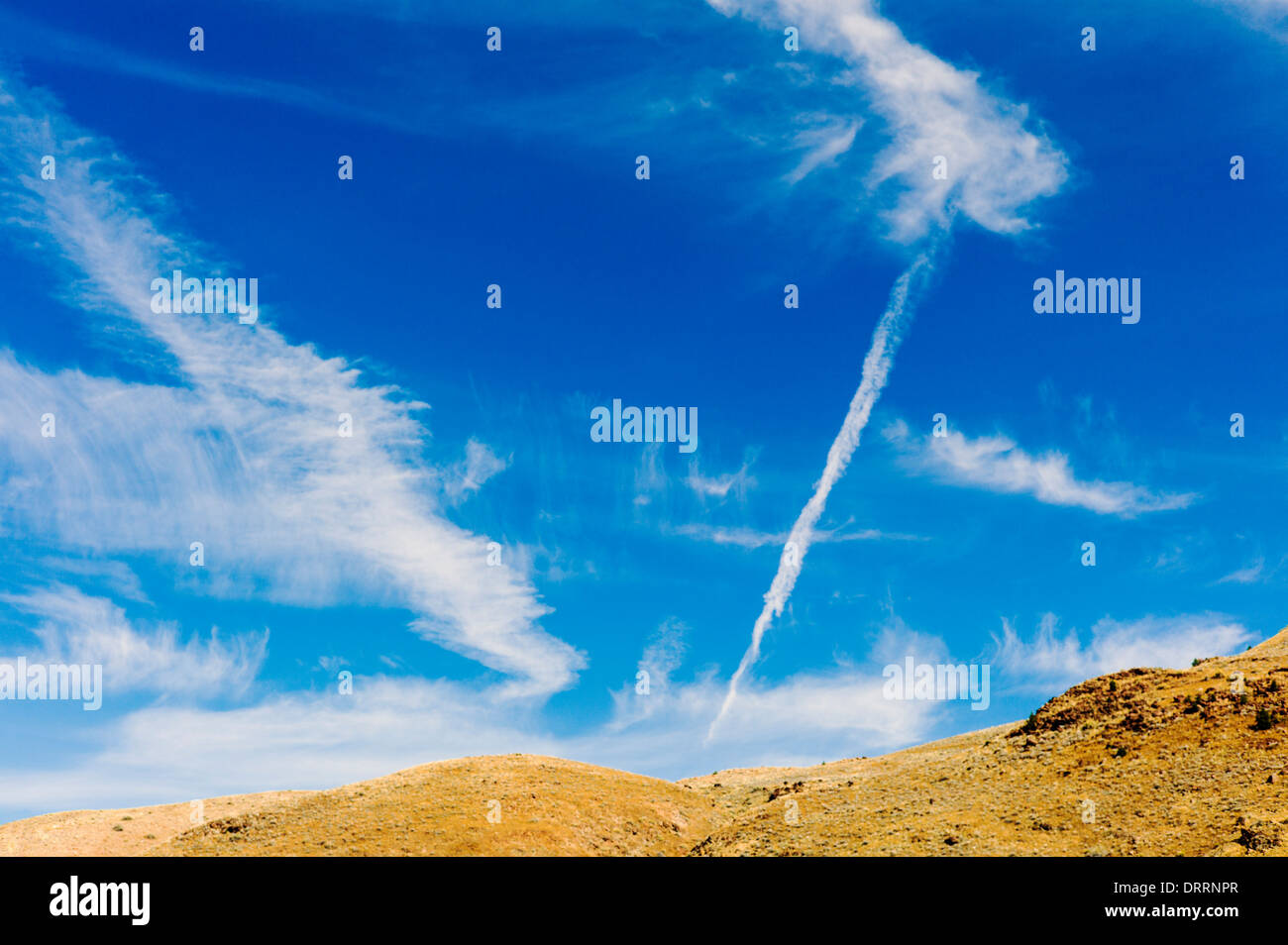 Unusual white clouds against a clear blue Colorado sky Stock Photo - Alamy