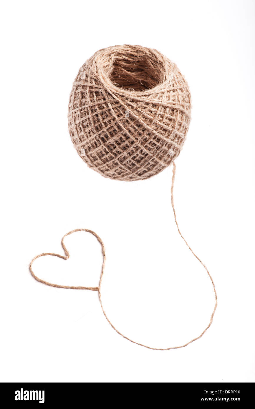 Picture of a heart made of rope, near a rope ball Stock Photo - Alamy