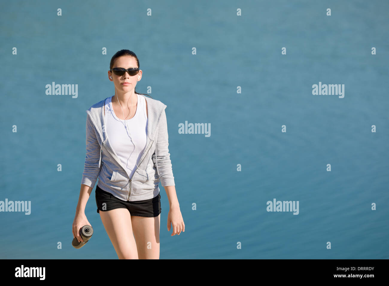 Summer sport fit woman walk on beach Stock Photo - Alamy