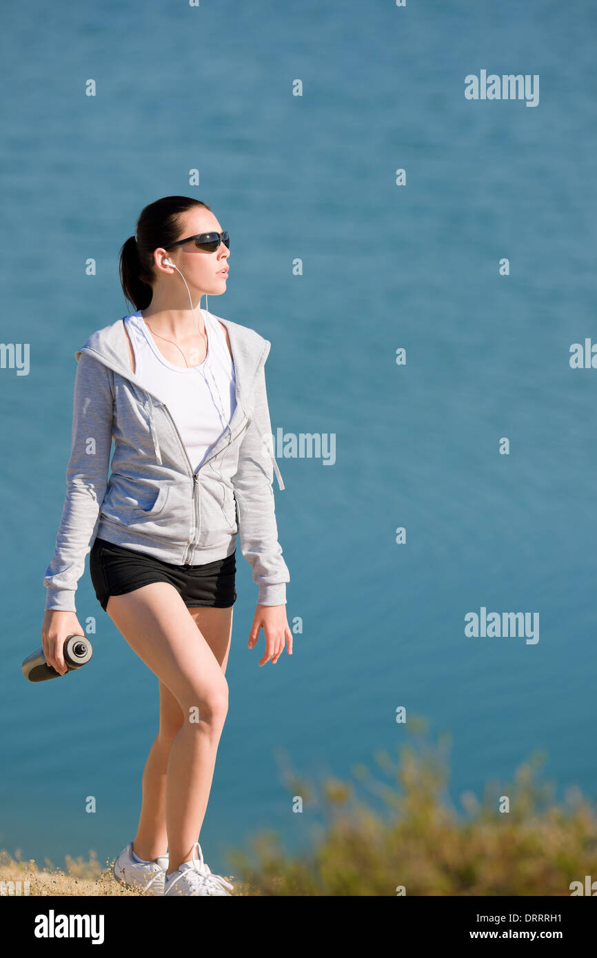 Summer sport fit woman walk on beach Stock Photo - Alamy
