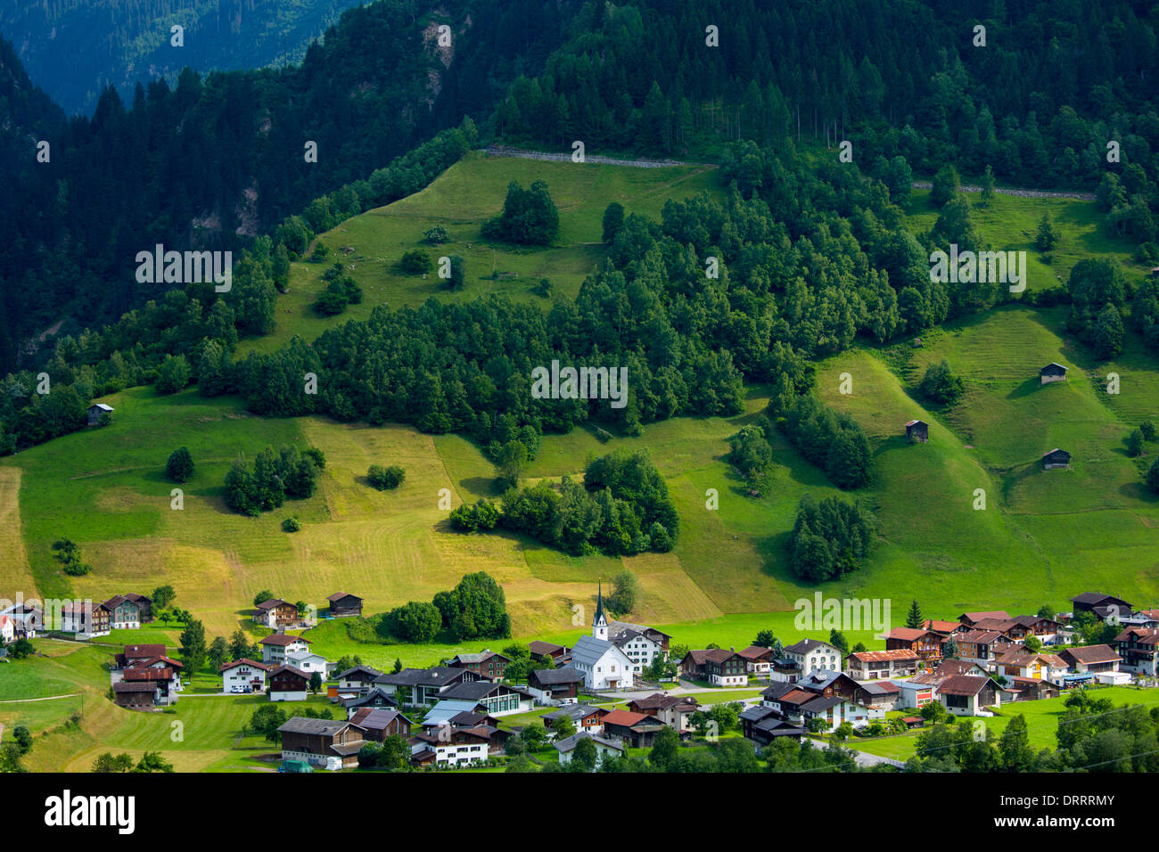 Swiss scene church and village of Surrein in mountain pass in the ...