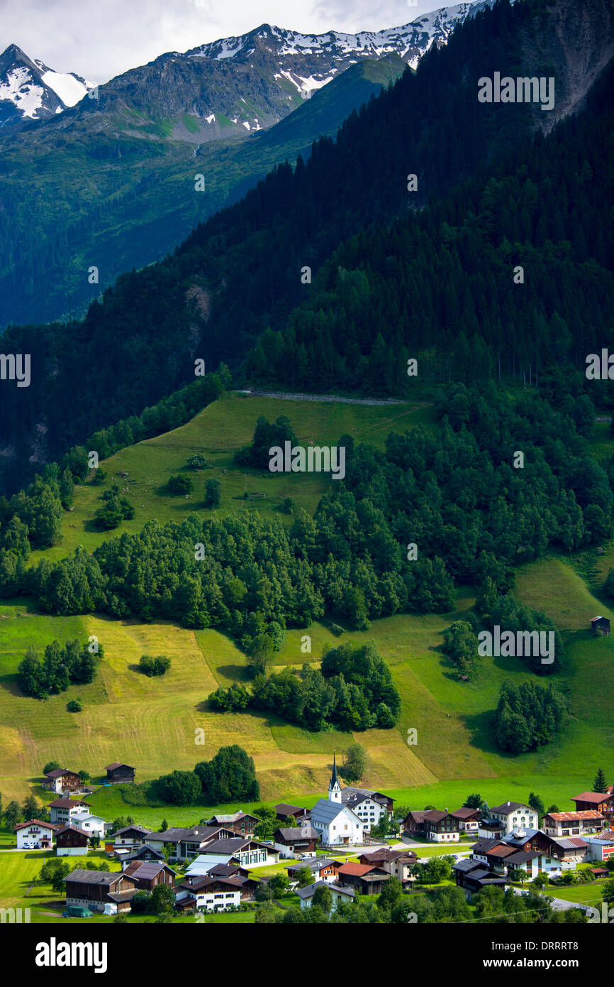 Swiss scene church and village of Surrein in mountain pass in the ...