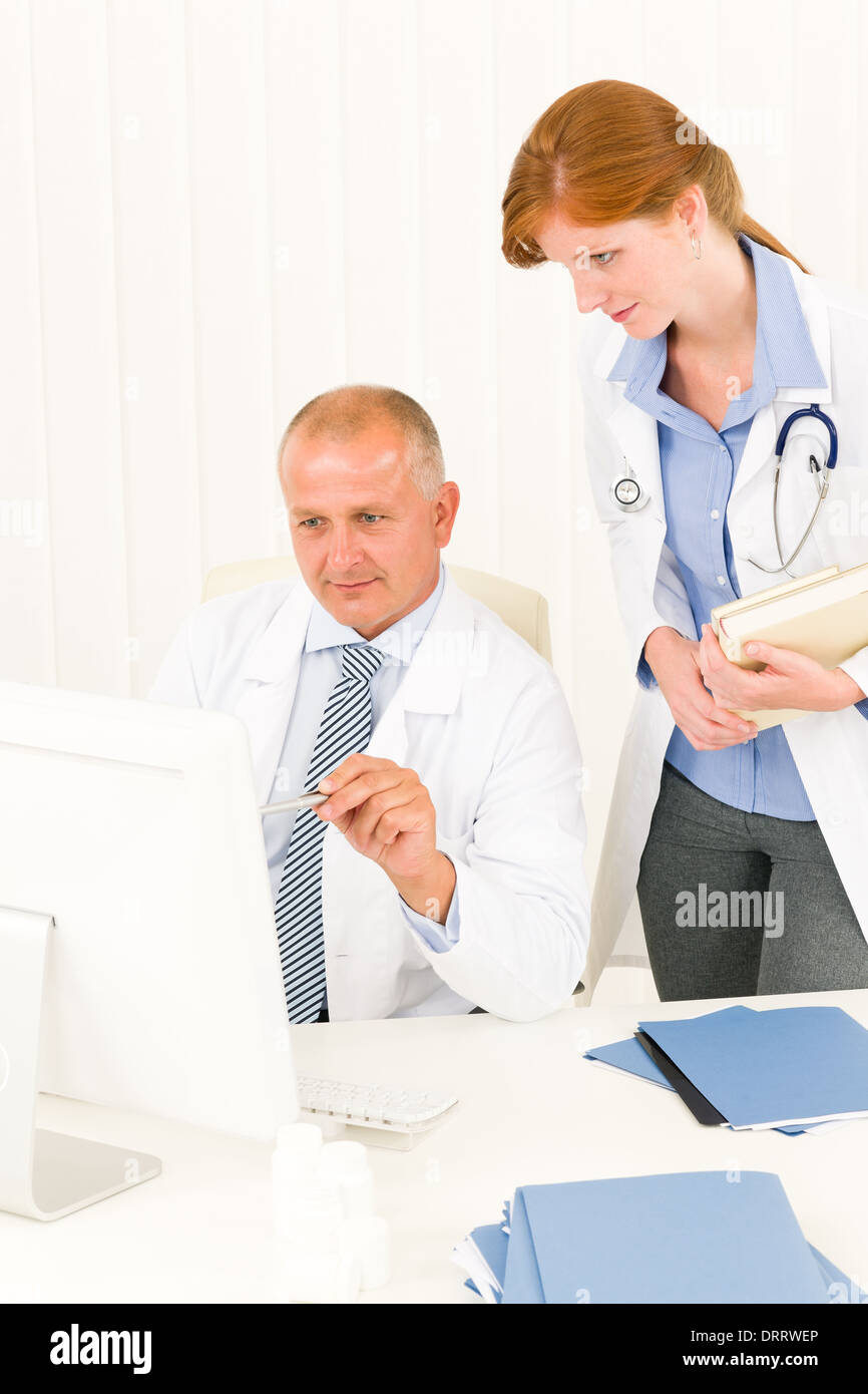 Medical team senior male young female doctor Stock Photo - Alamy