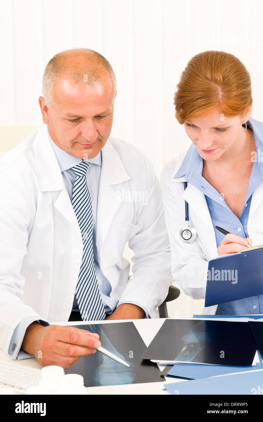 Medical doctor team look point at x-ray Stock Photo - Alamy