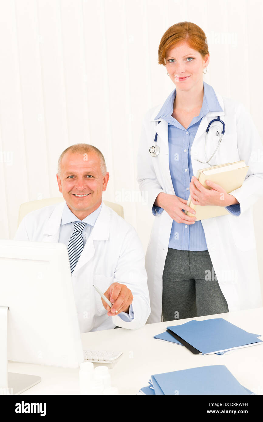 Medical doctor team senior male young woman Stock Photo - Alamy