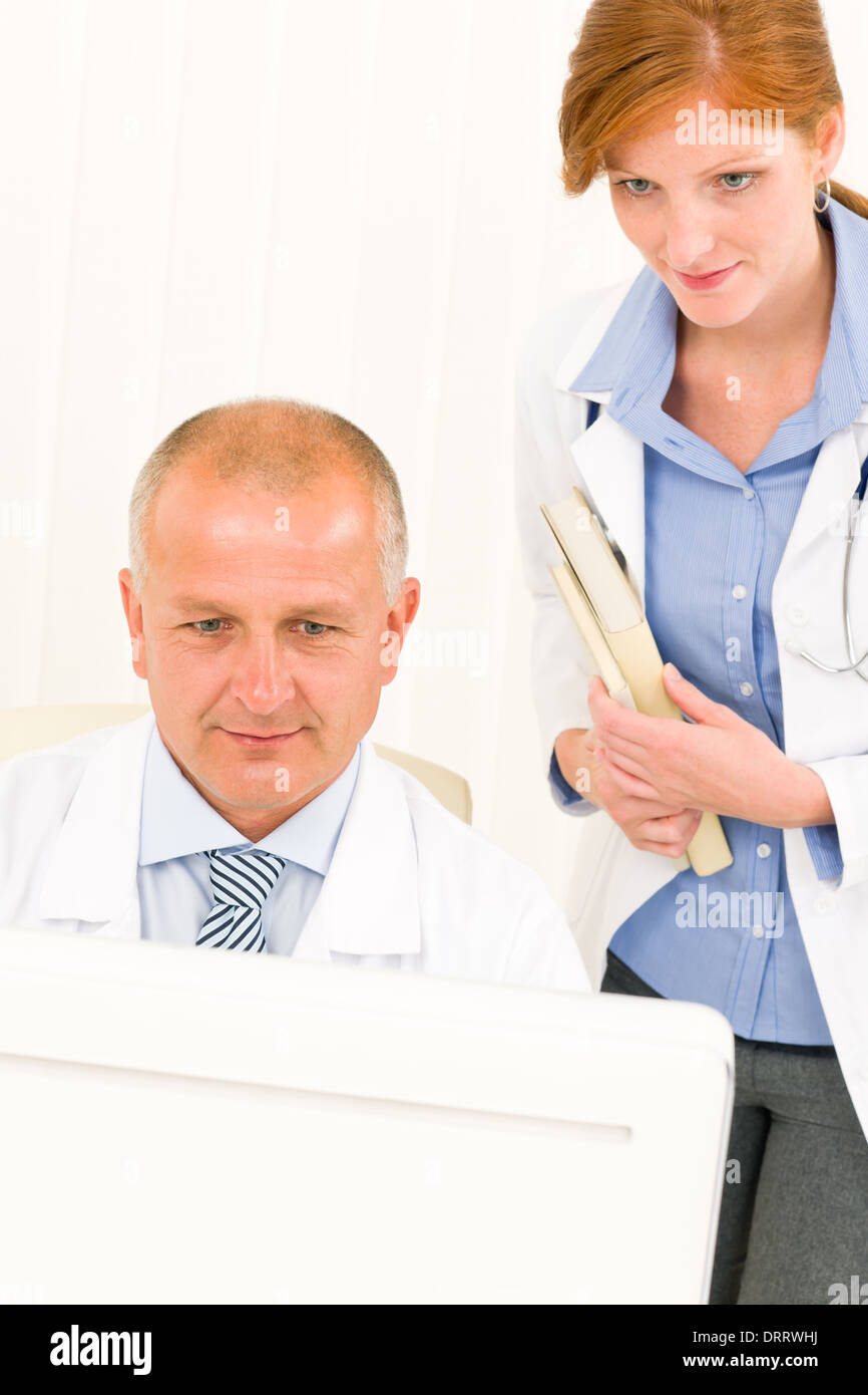 Medical team doctors look at computer Stock Photo - Alamy