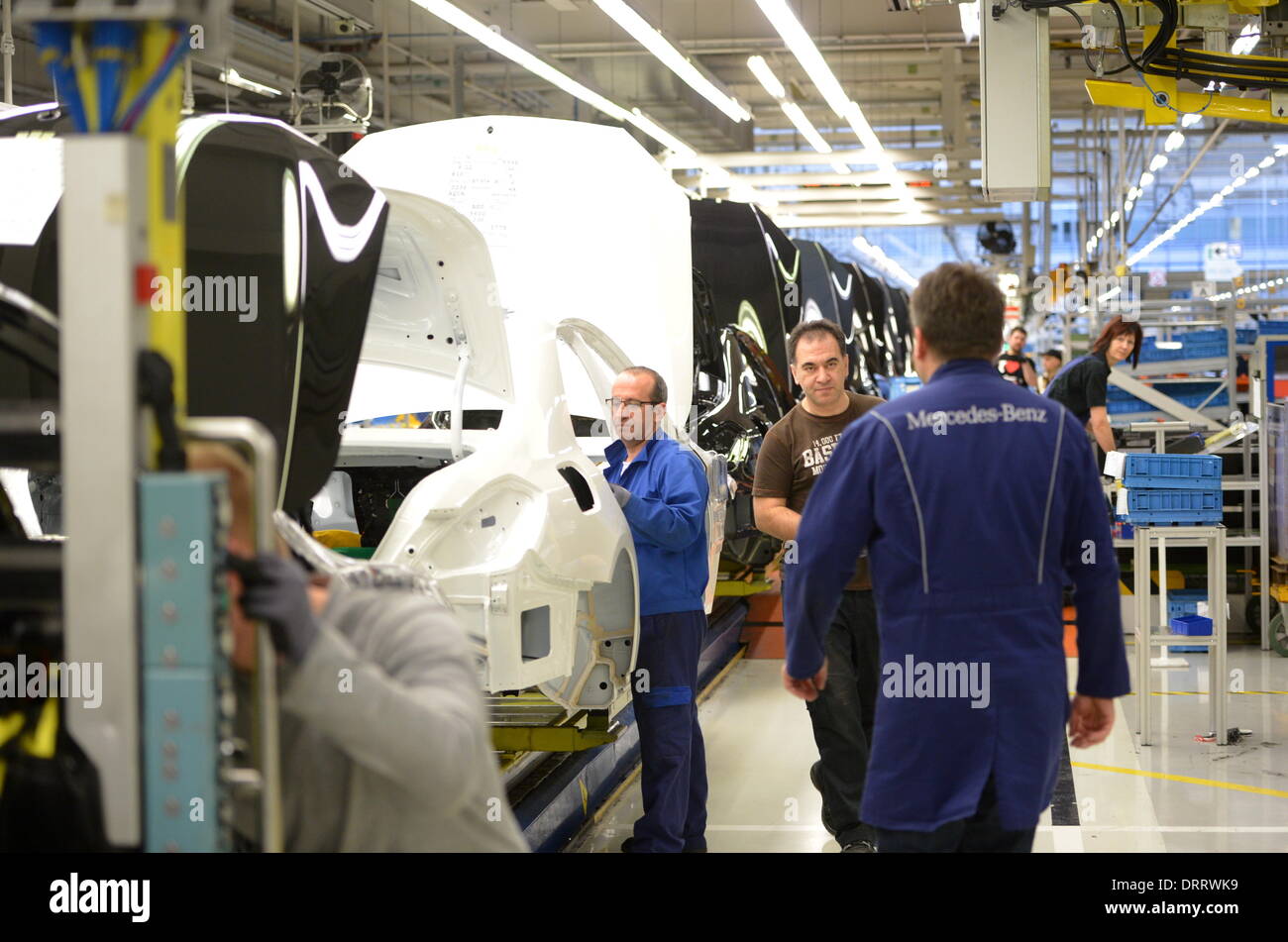 Employees work on Mercedes cars during the production of S-Class ...