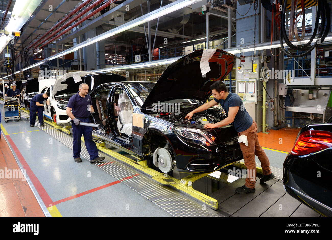 Employees work on Mercedes cars during the production of S-Class ...