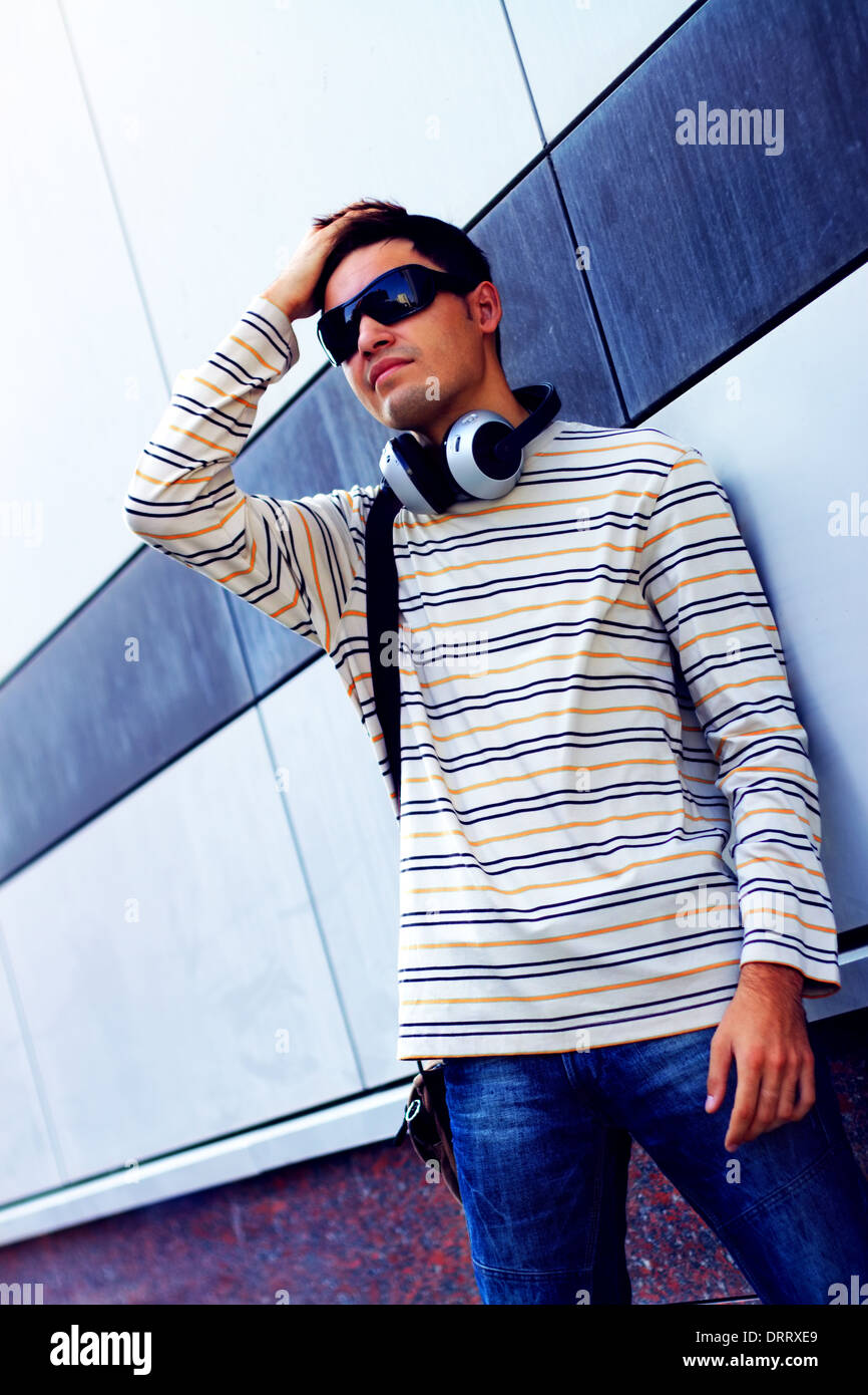 Trendy young man near fence hi-res stock photography and images - Alamy