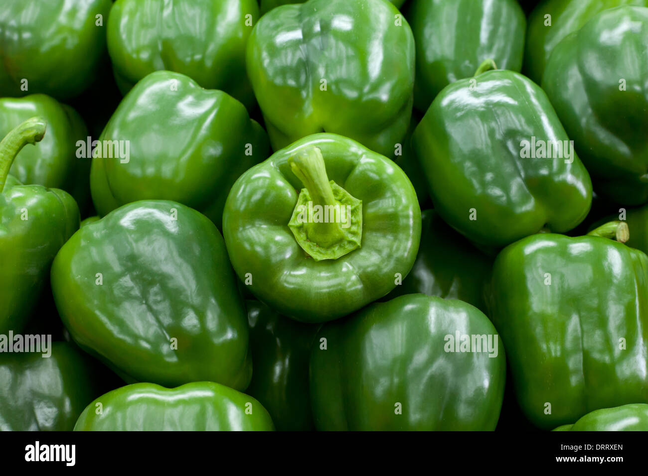 Fresh green bell peppers background Stock Photo - Alamy