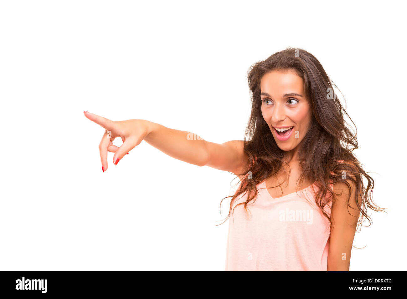 A beautiful woman pointing to something, isolated over a white ...