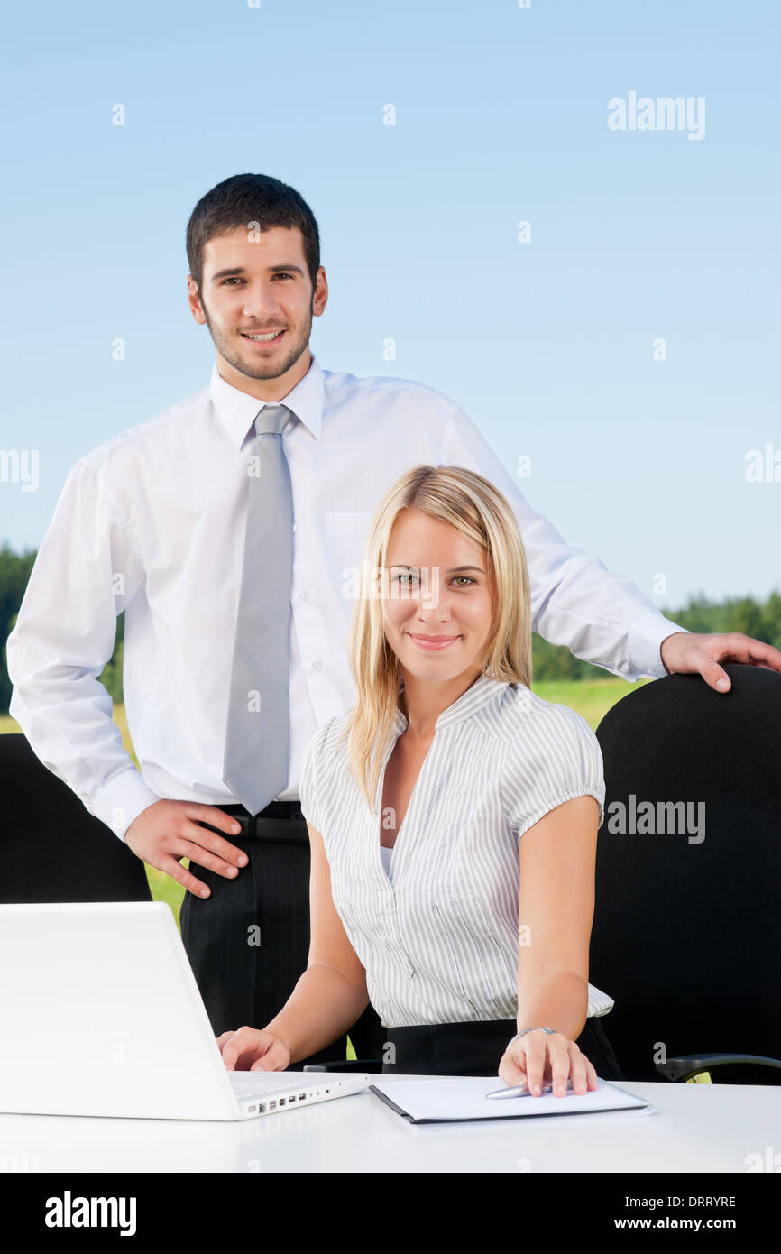 Business colleagues in nature office smile Stock Photo - Alamy
