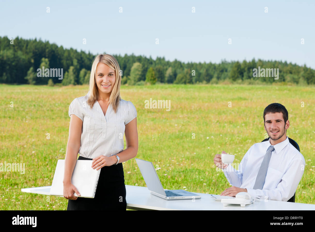 Business colleagues in nature office smile Stock Photo - Alamy