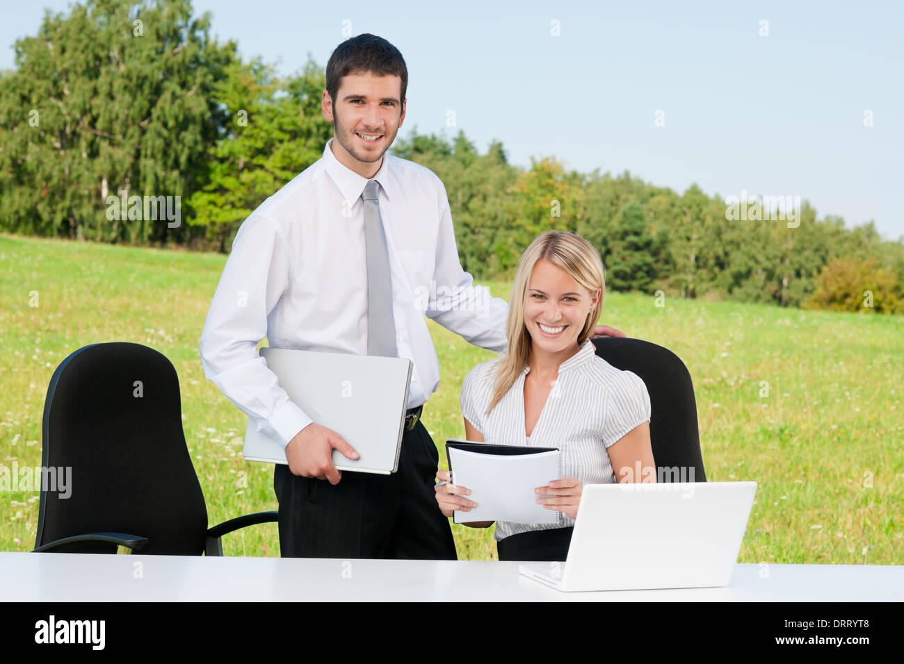 Business colleagues in nature office smile Stock Photo - Alamy